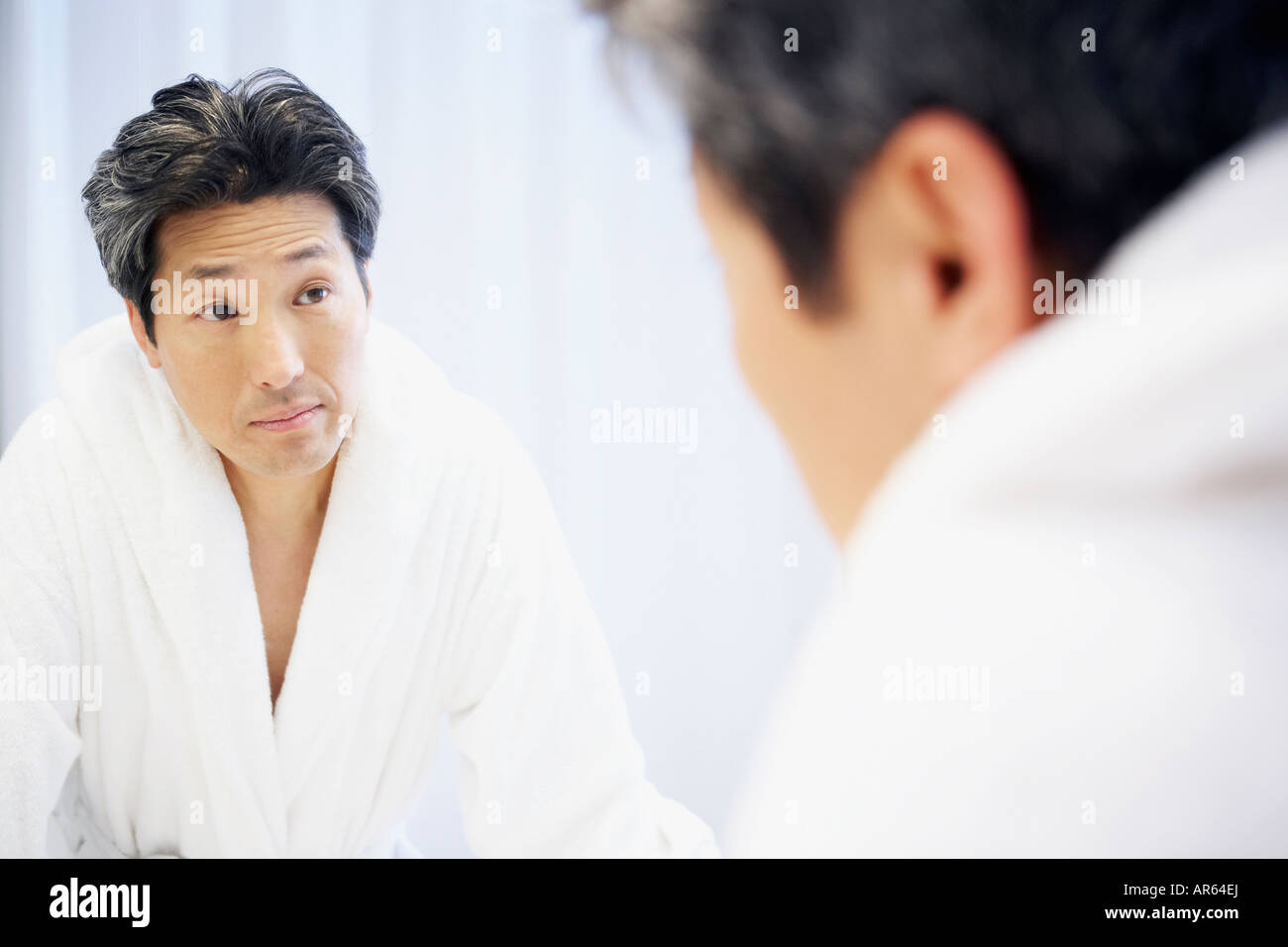 Man staring reflection in bathroom hi-res stock photography and images ...