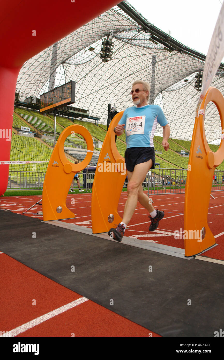 Runner finish the race at goal Stock Photo - Alamy