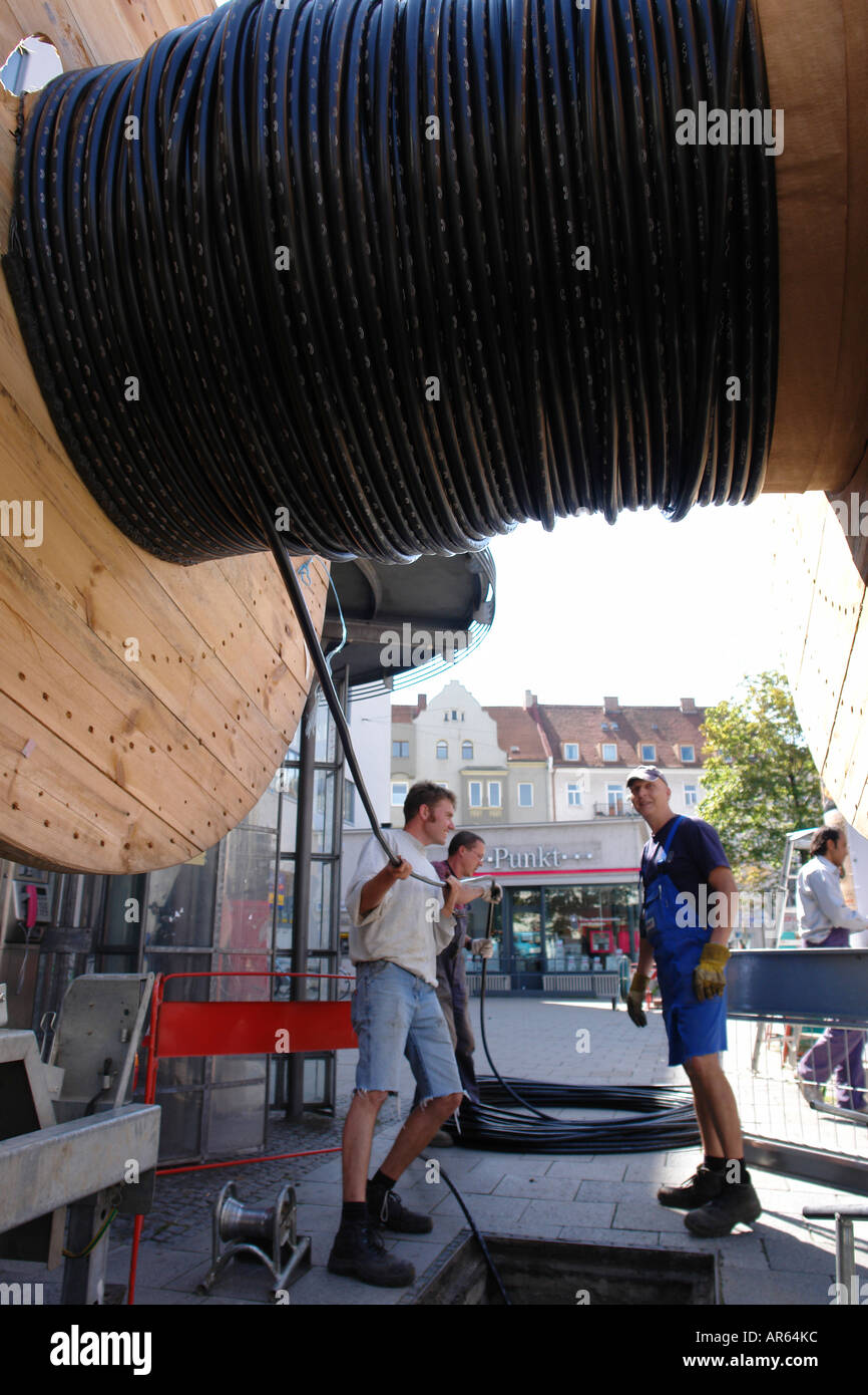 Worker lay underground cable in city Munich Bavaria Germany Stock Photo ...