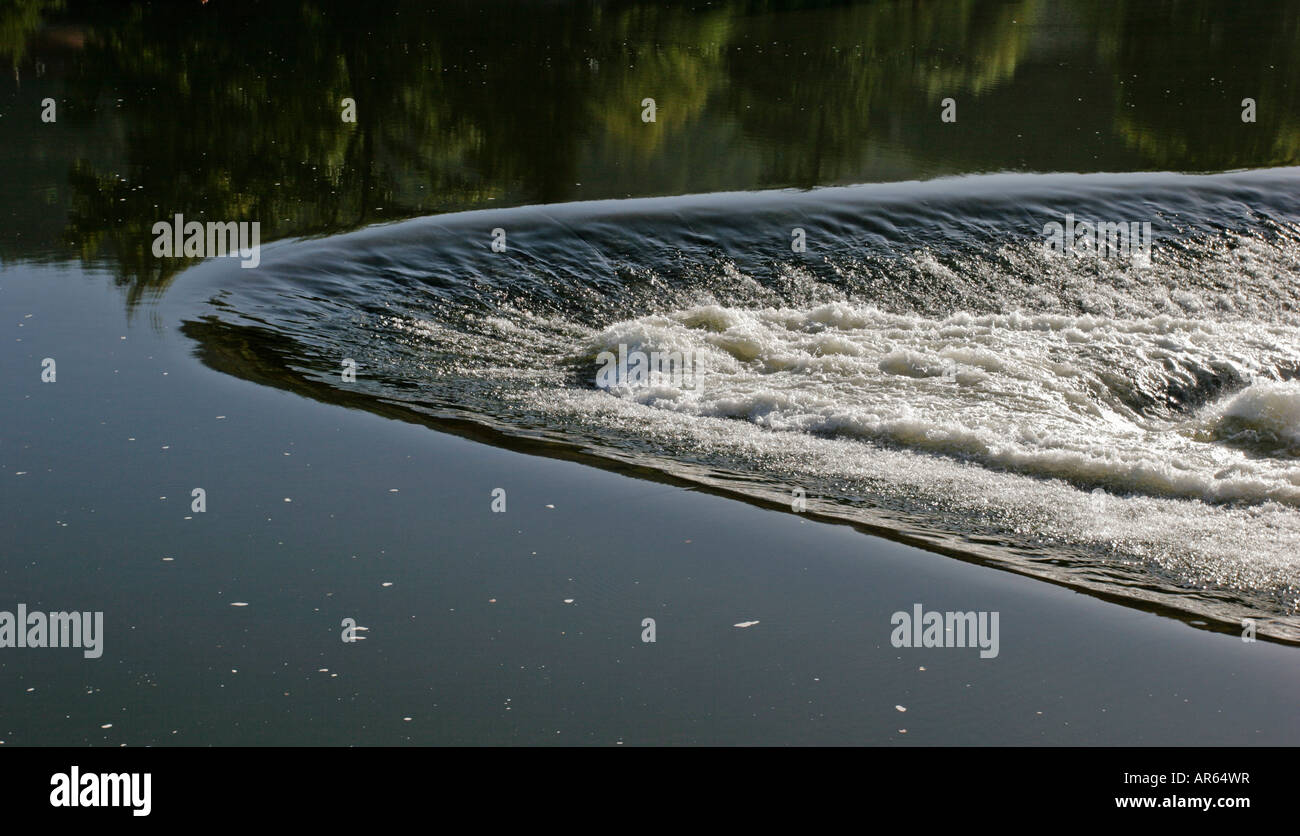 Curved river weir Stock Photo - Alamy