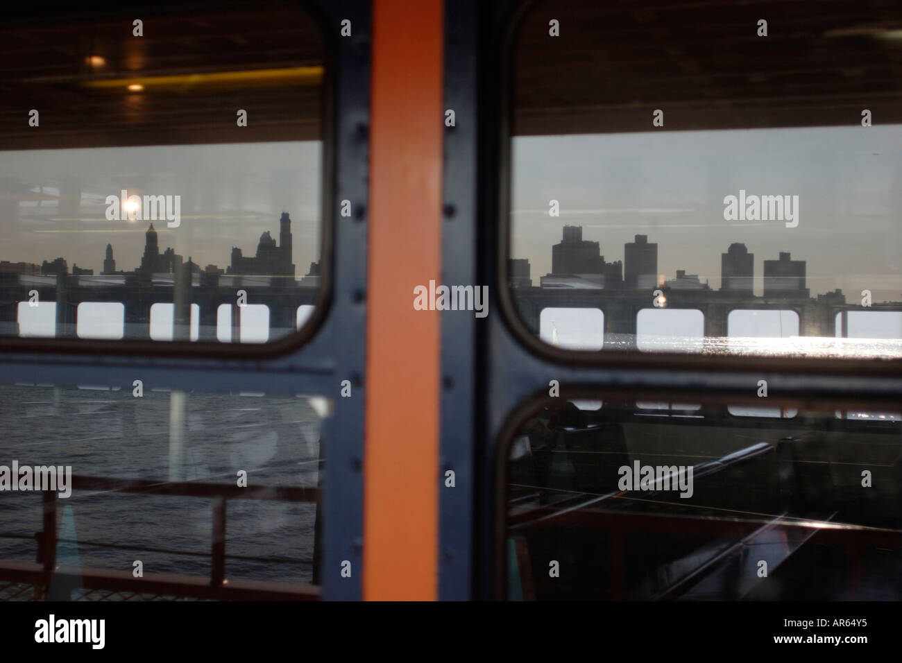 Windows of a ferry reflecting Manhattan's skyline, Manhattan, New York ...