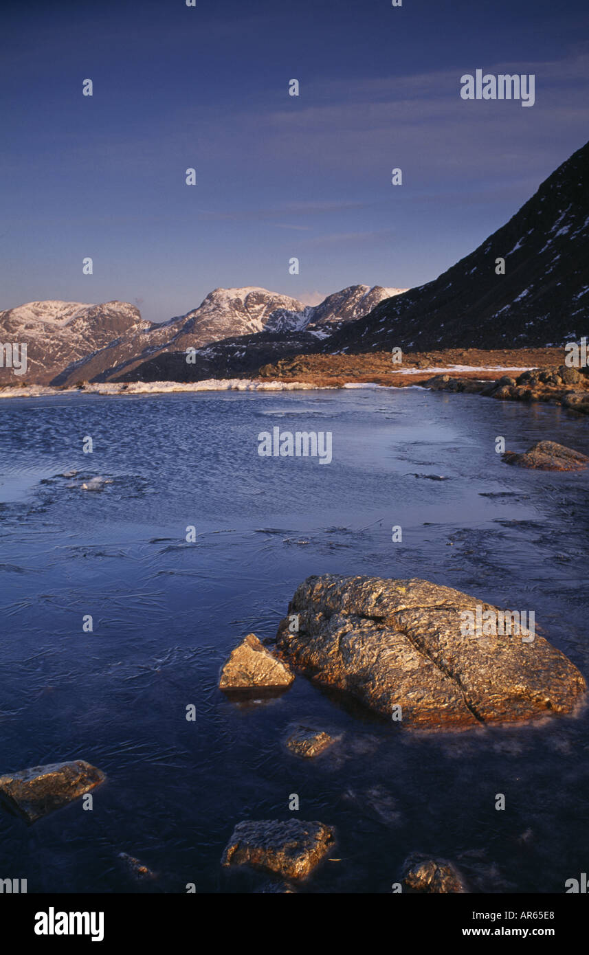Three Tarns Bow Fell with Scafell beyond A wintry scene in Cumbria ...