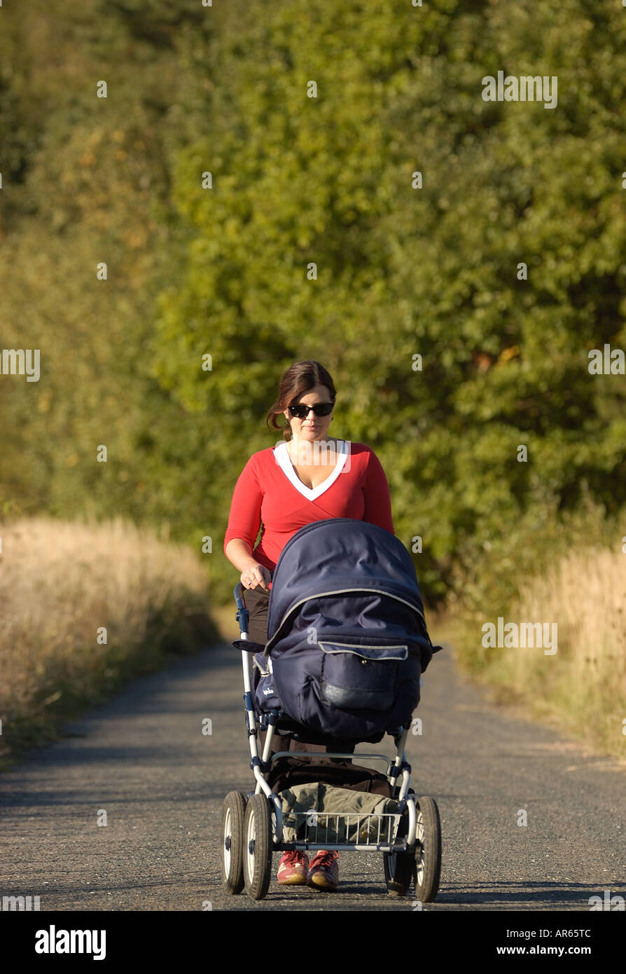 Lady pushing a pram hi-res stock photography and images - Alamy