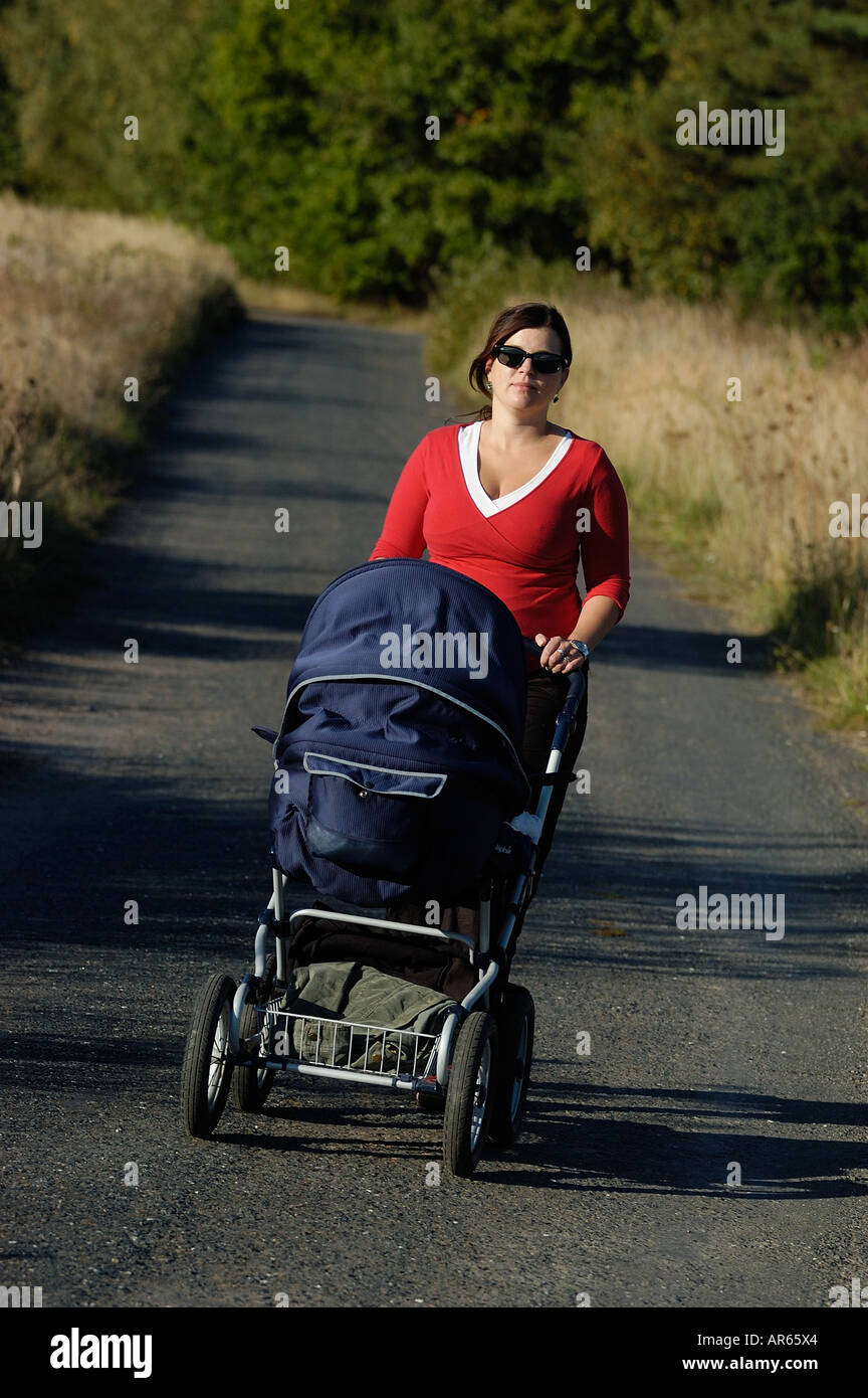 Lady pushing a pram hi-res stock photography and images - Alamy