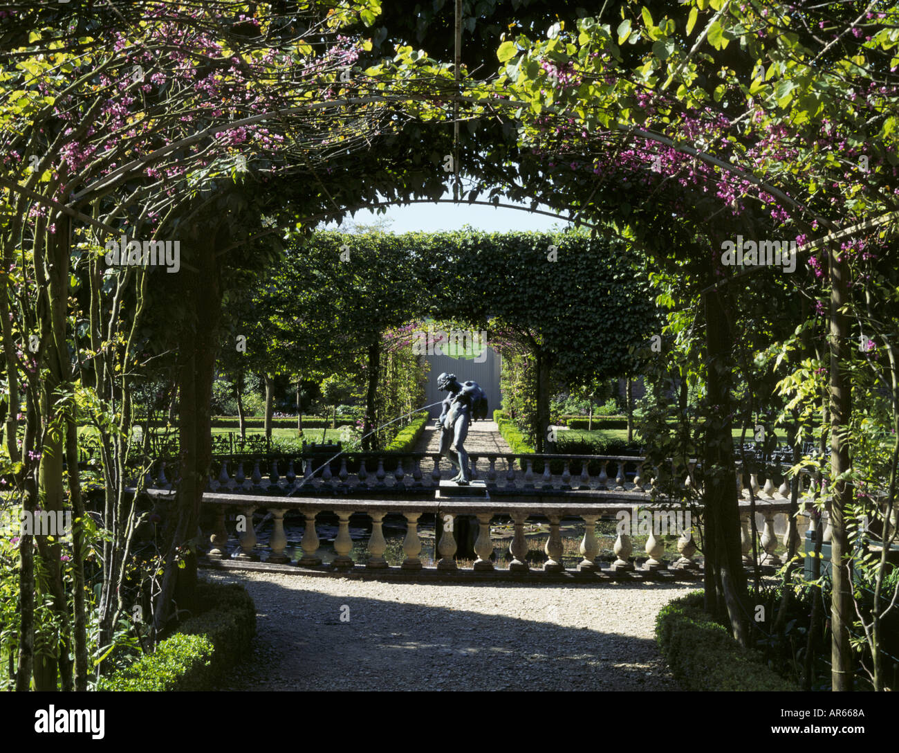 Close up of the statue fountain in the lily pond at Buscot Park in the ...