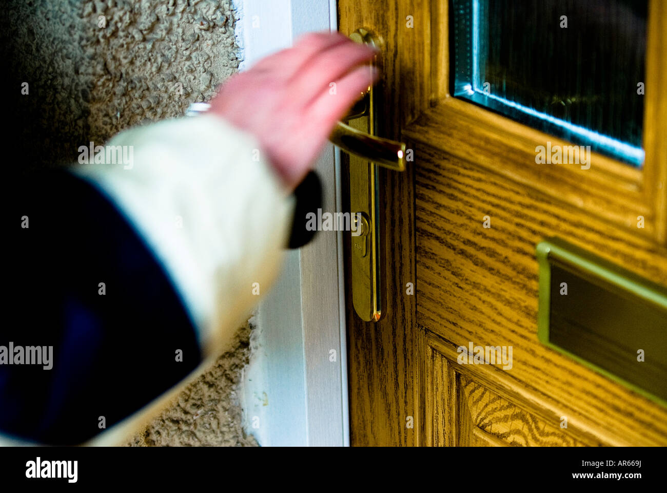 female opening exterior door Stock Photo - Alamy