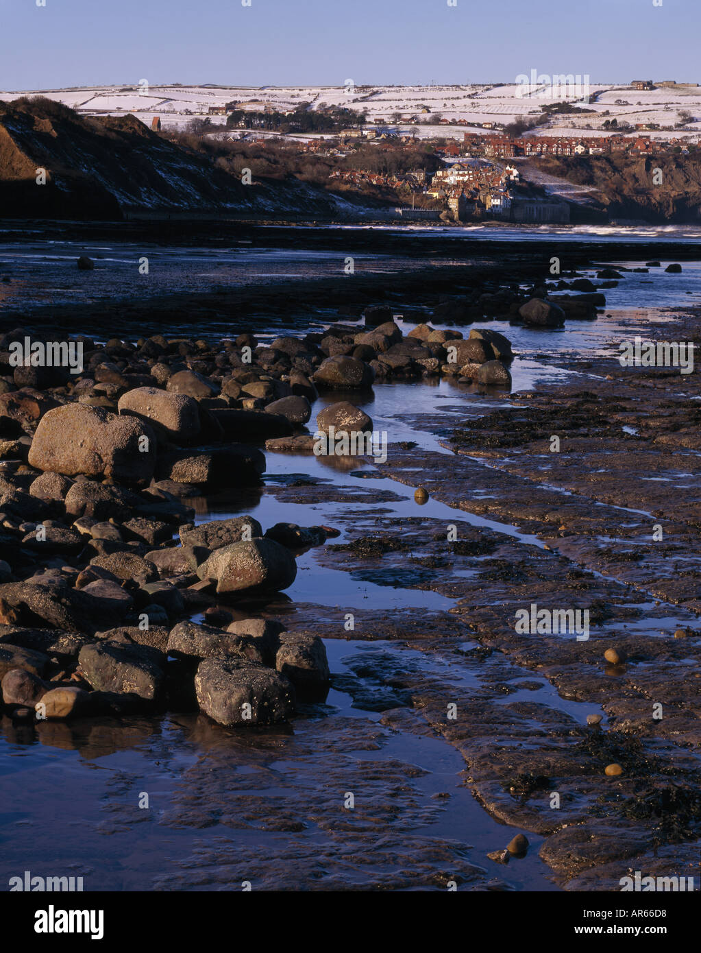 Boulders on the beach of Robin Hoods Bay and Boggle Hole looking North ...