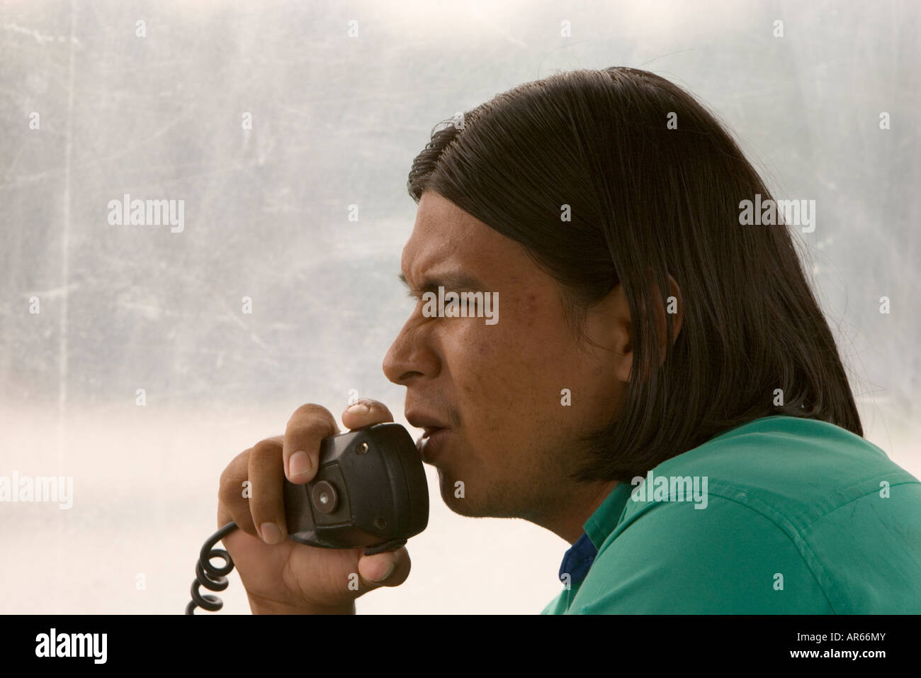 Man talking on 2-way radio Stock Photo - Alamy