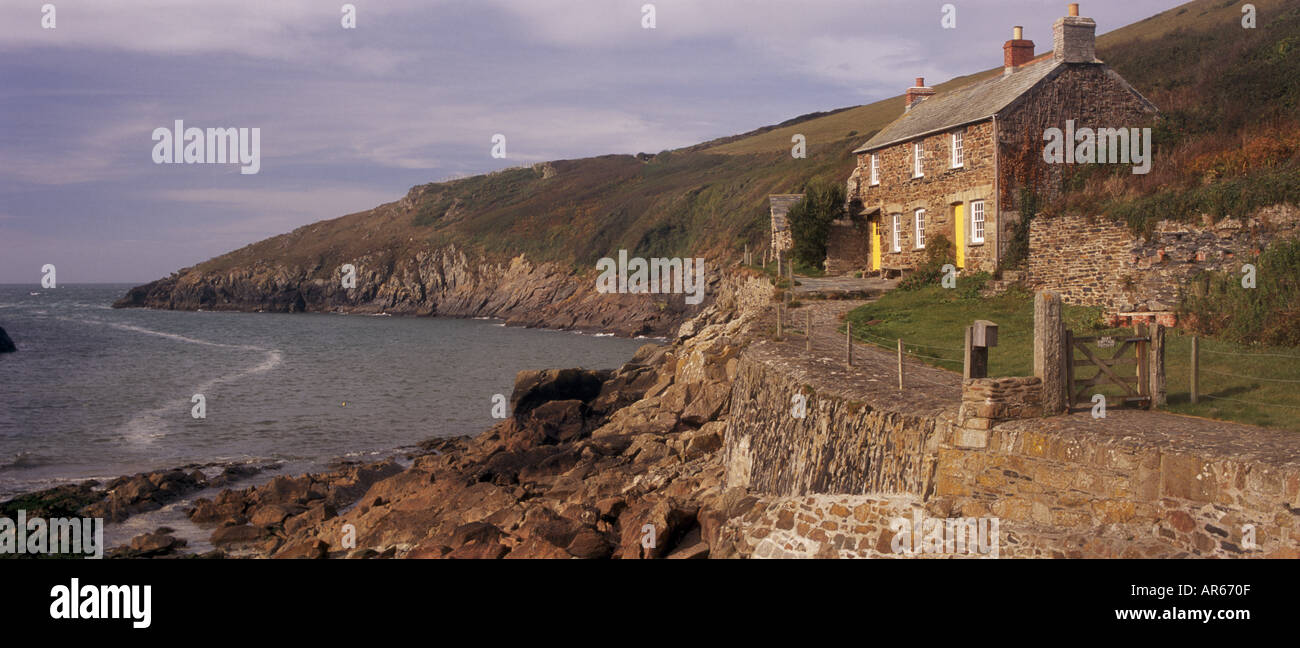 Quay Cottage a stone building sitting on the edge of a rocky foreshore ...