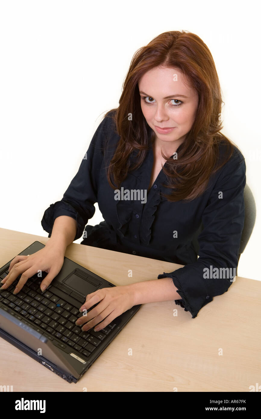 Secretary on laptop Stock Photo - Alamy