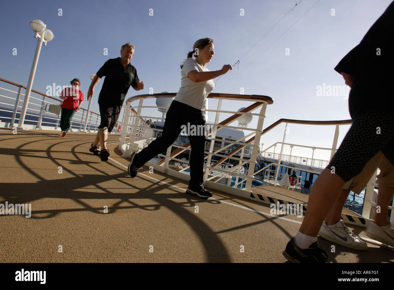 early morning exercise, walking, sun deck, jogging path, cruise ship MS ...