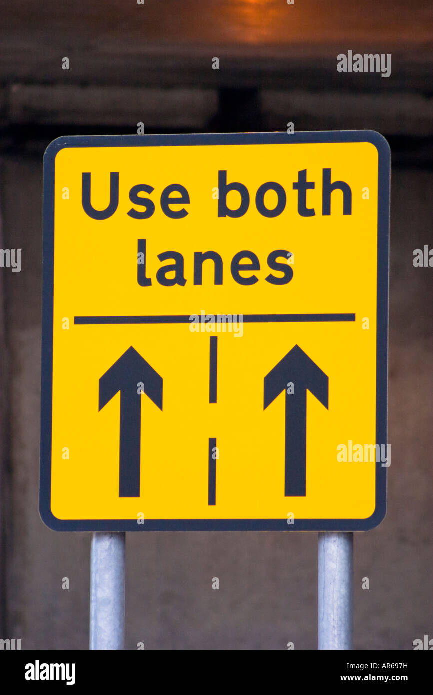 Use both lanes road sign Stock Photo - Alamy