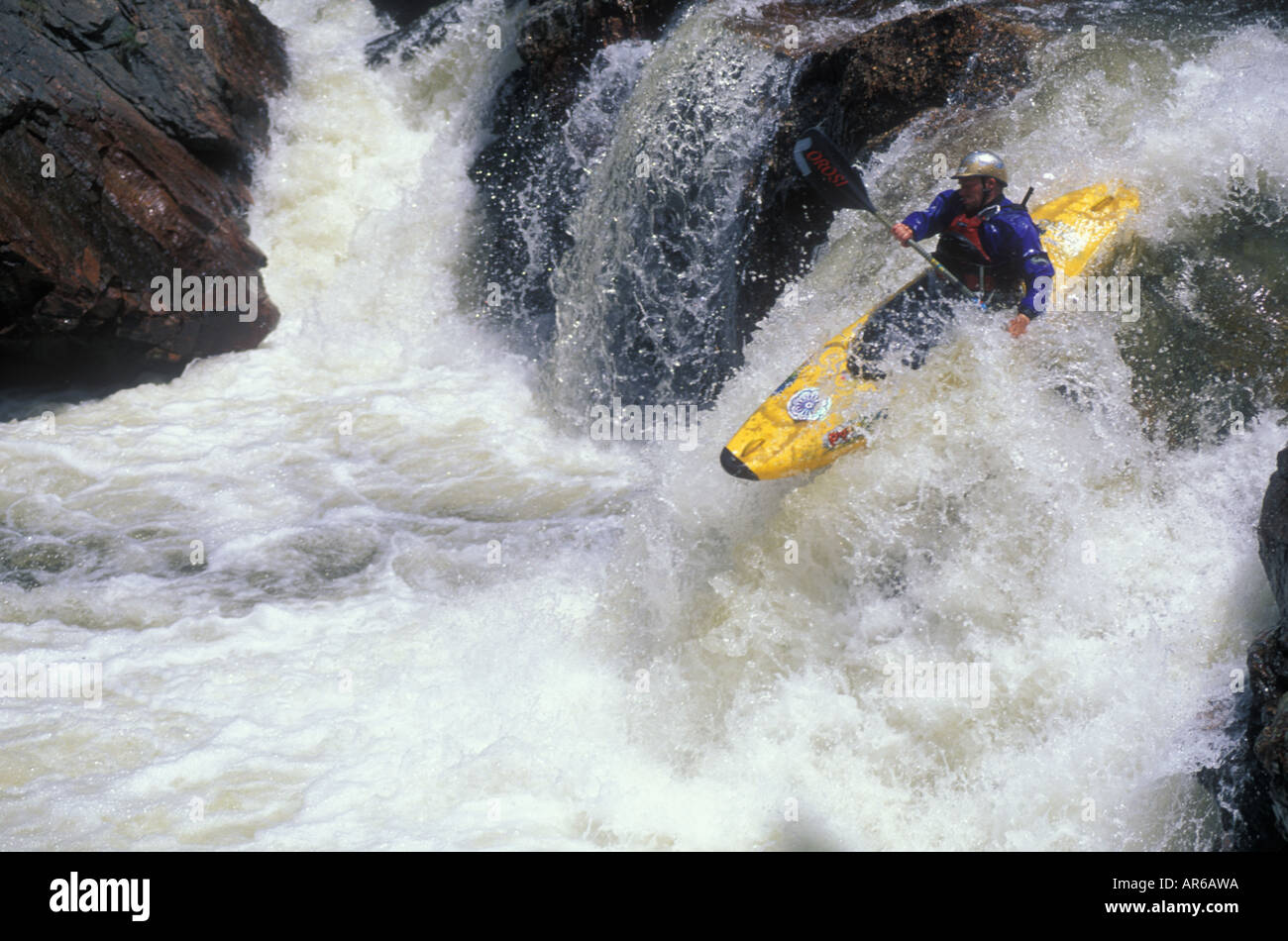 Whitewater kayaker paddling down a waterfall Stock Photo - Alamy