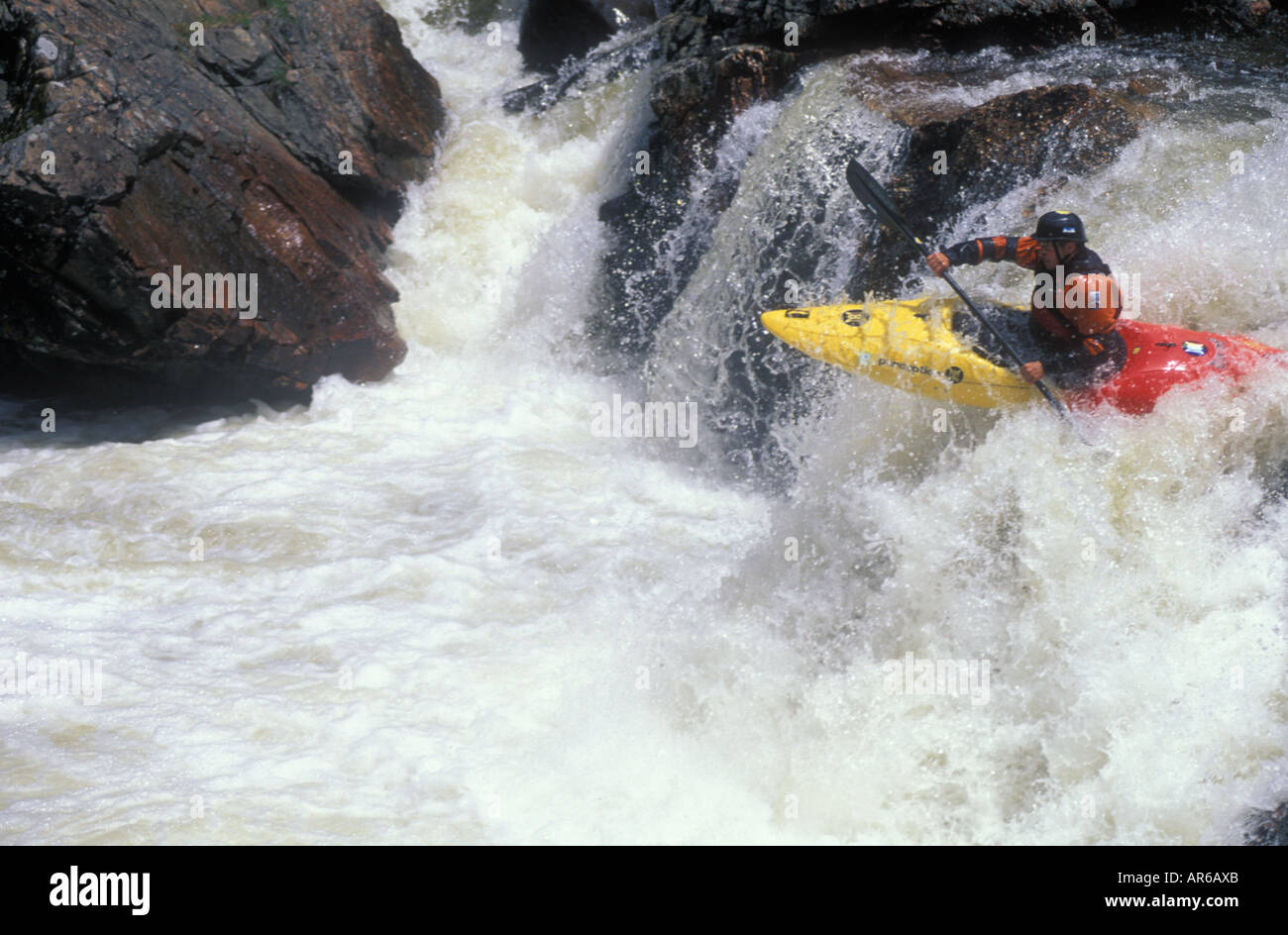 Whitewater kayaker paddling down a waterfall Stock Photo - Alamy