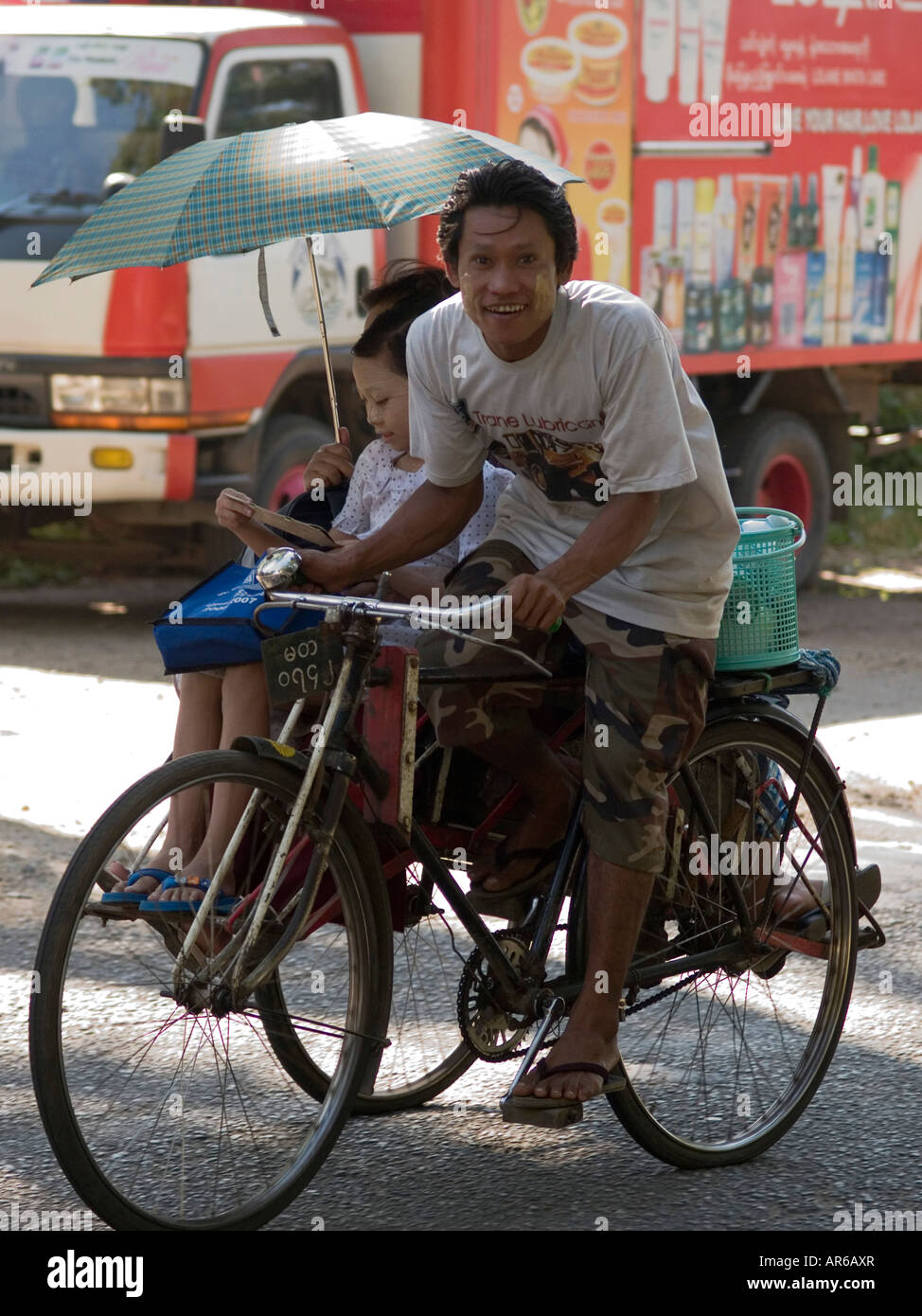 rickshaw driver smiling in Myanmar Stock Photo - Alamy