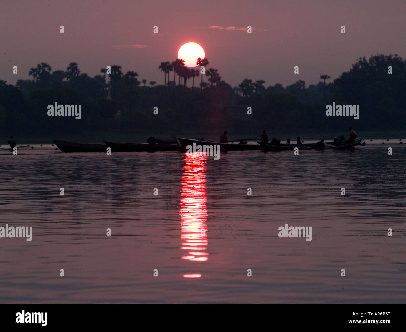 sunrise reflection in Myanmar Stock Photo - Alamy