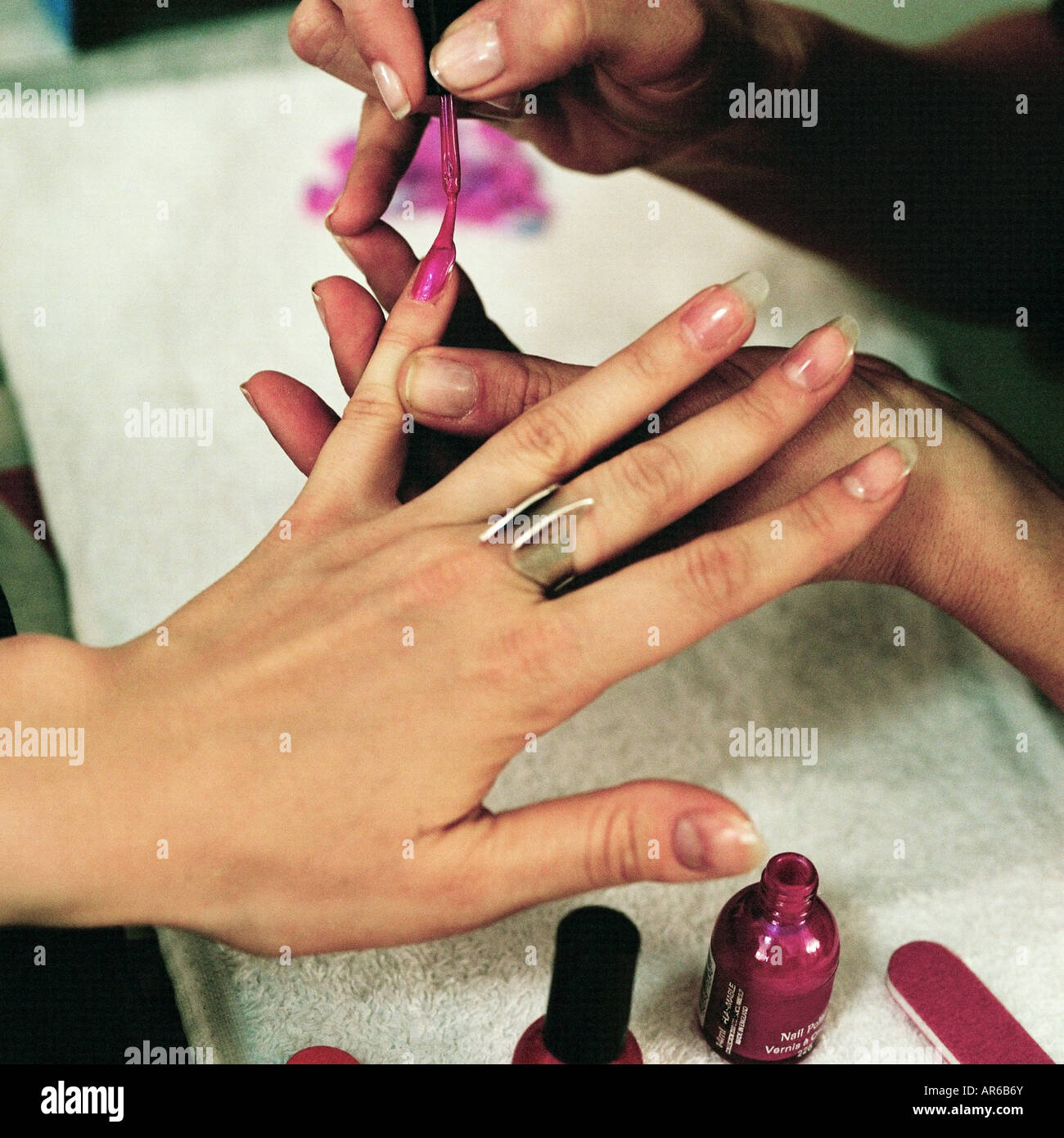 Woman having a manicure Stock Photo - Alamy