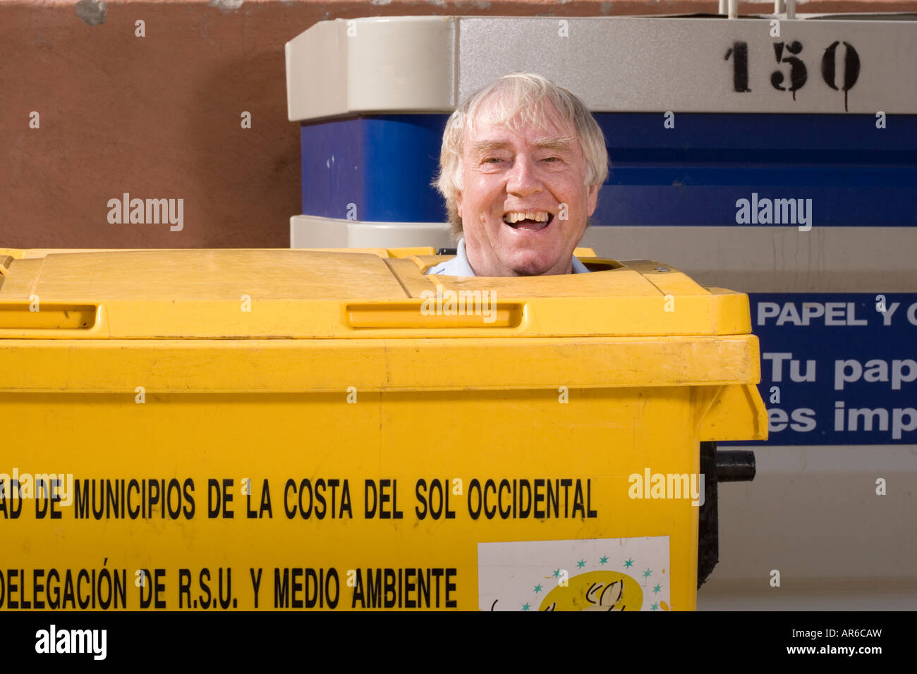 senior man inside recycle bin with just head showing and smiling Stock ...