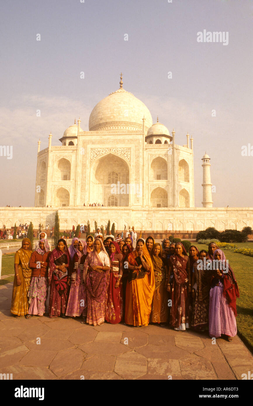 Hindu women in colorful dress in front of the beautiful Taj Mahal ...