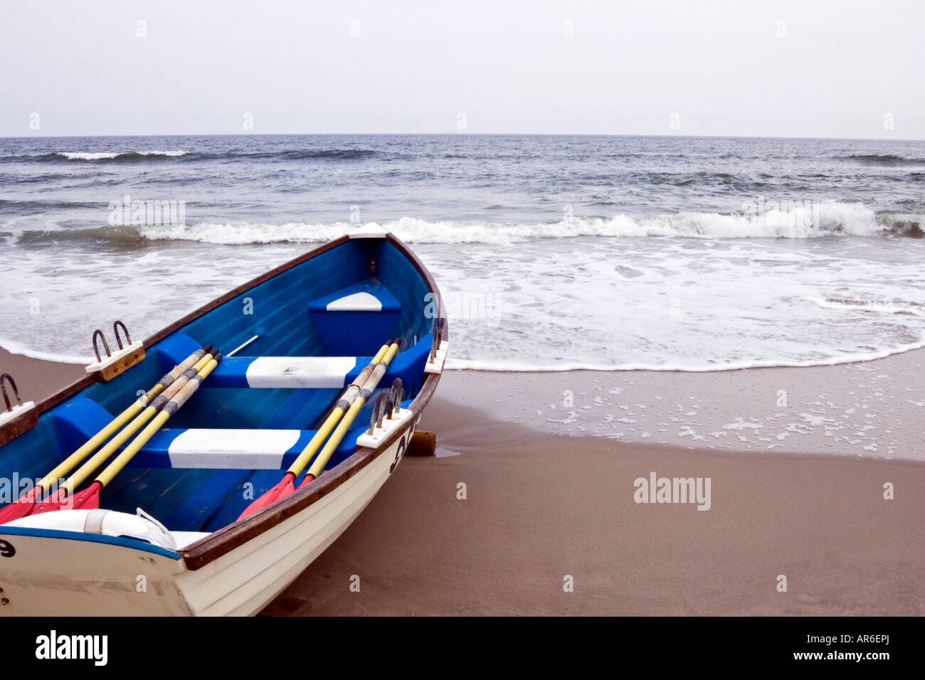 Beached red rowboat hi-res stock photography and images - Alamy