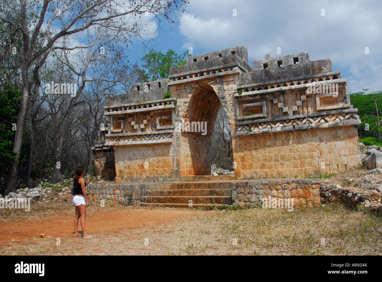 Female tourist watching the arch of Labna, Yucatan State, Mexico, North ...