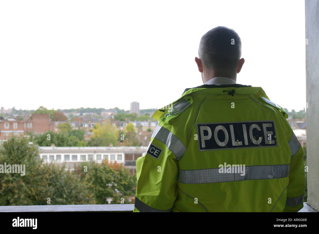 A police man ion a balcony during a patrol of the Andover council ...