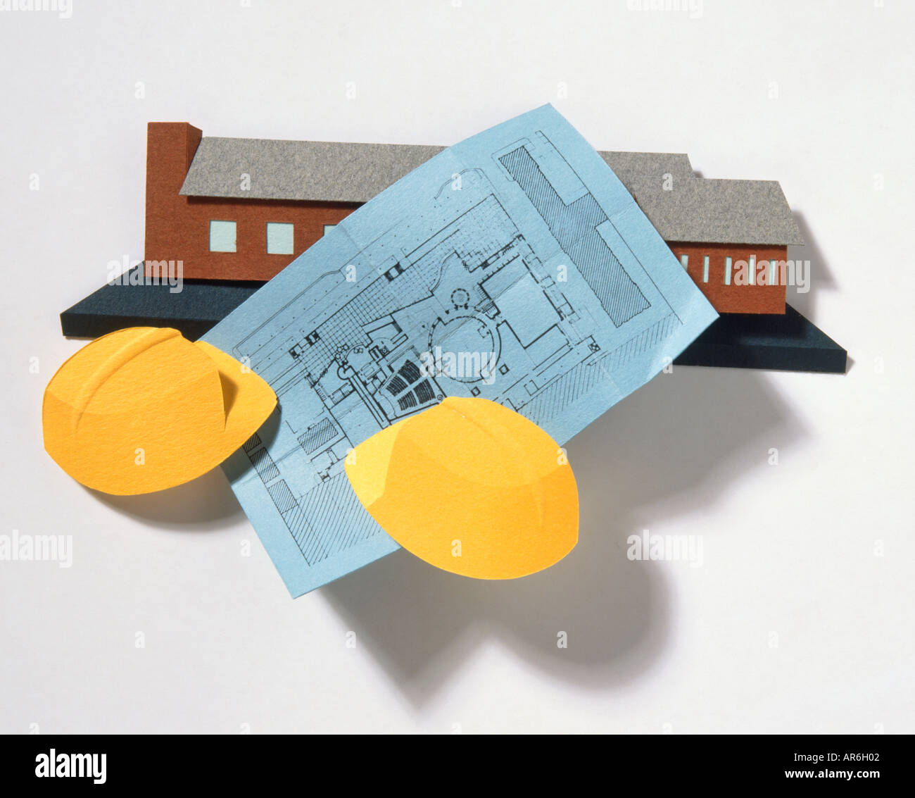 Paper model of building plan drawn on blue paper, two hard yellow ...