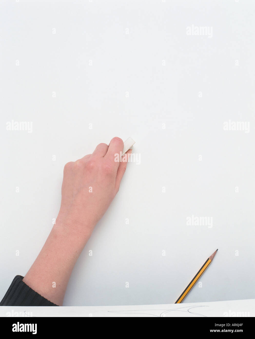 Hand holding white rubber eraser hi-res stock photography and images ...