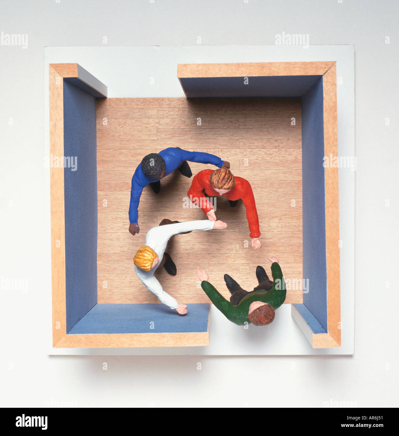 Model room viewed from above, three colourful model figurines standing ...