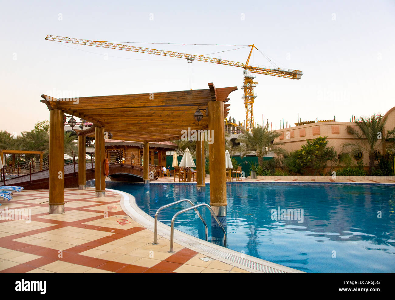 Ras Al Khaimah Beach Club UAE, Swimming Pool with Construction Crane ...