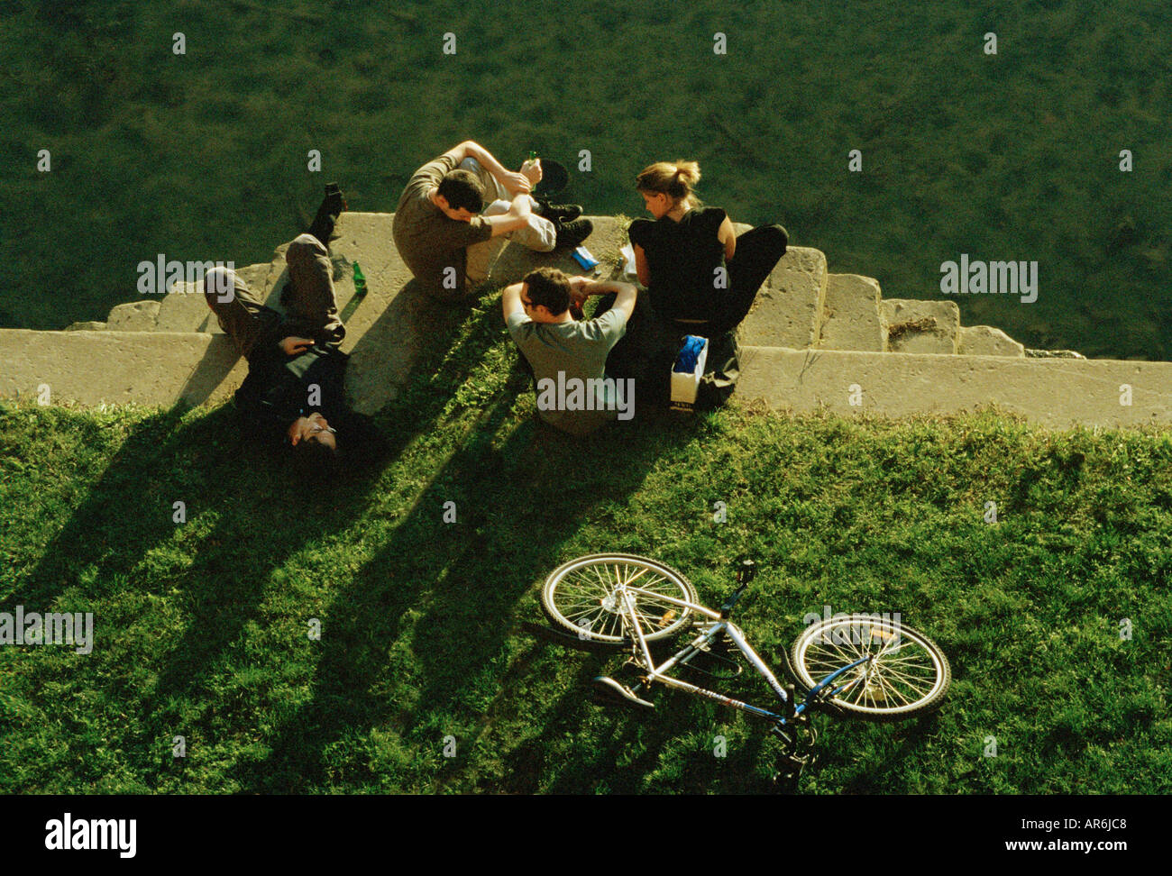 Friends relax sitting bicycle hi-res stock photography and images - Alamy