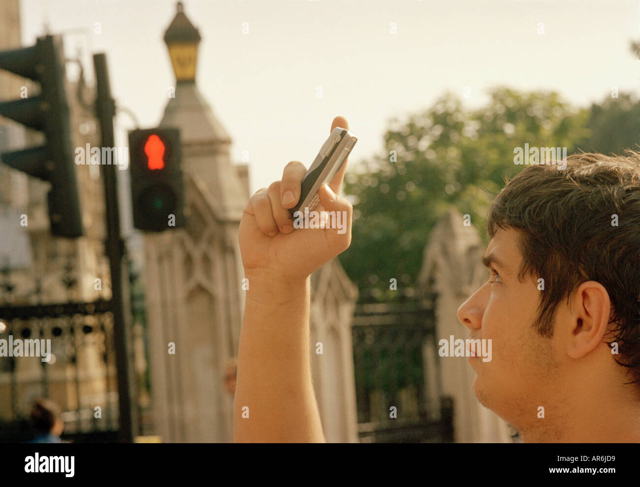 Man using a mobile phone camera Stock Photo - Alamy