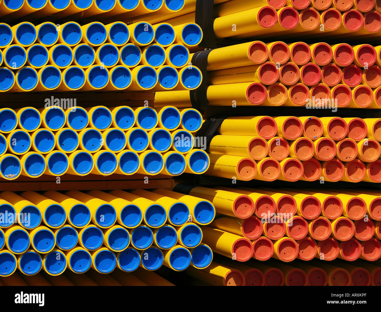 Colorful capped PVC pipes or tubes ready for shipment to project site ...