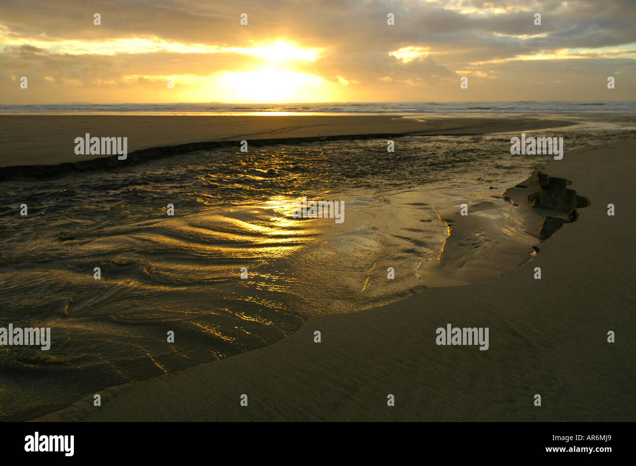 Scenic view of a river delta running to the ocean across an expanse of ...