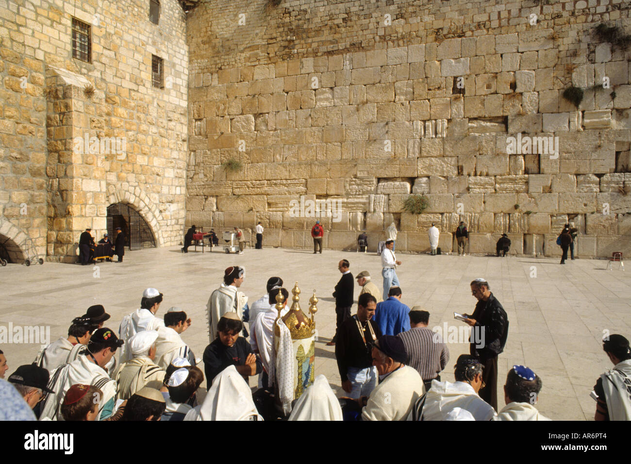 Traditional men praying at the famous religious Western Wall also ...