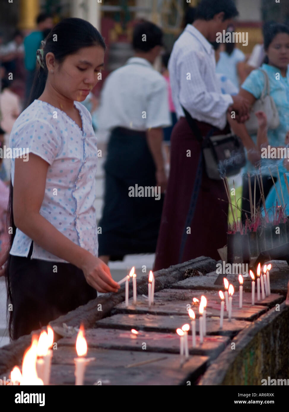 lighting candles for blessing at Shwedagon Paya Burma s most famous ...