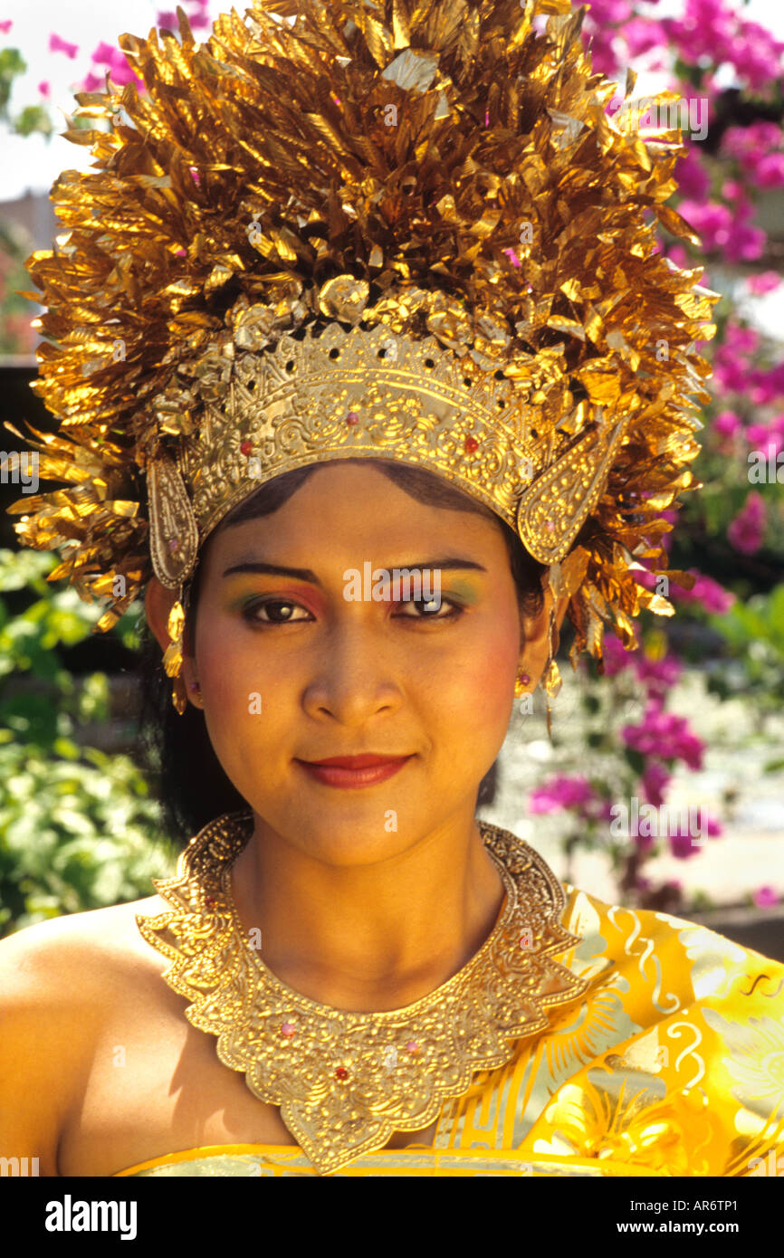 Beautiful golden bride in colorful traditional dress in wedding in Bali ...