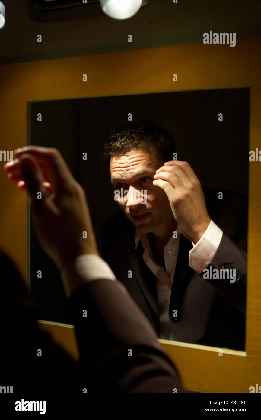 Man Looking Himself In Mirror High Resolution Stock Photography and ...