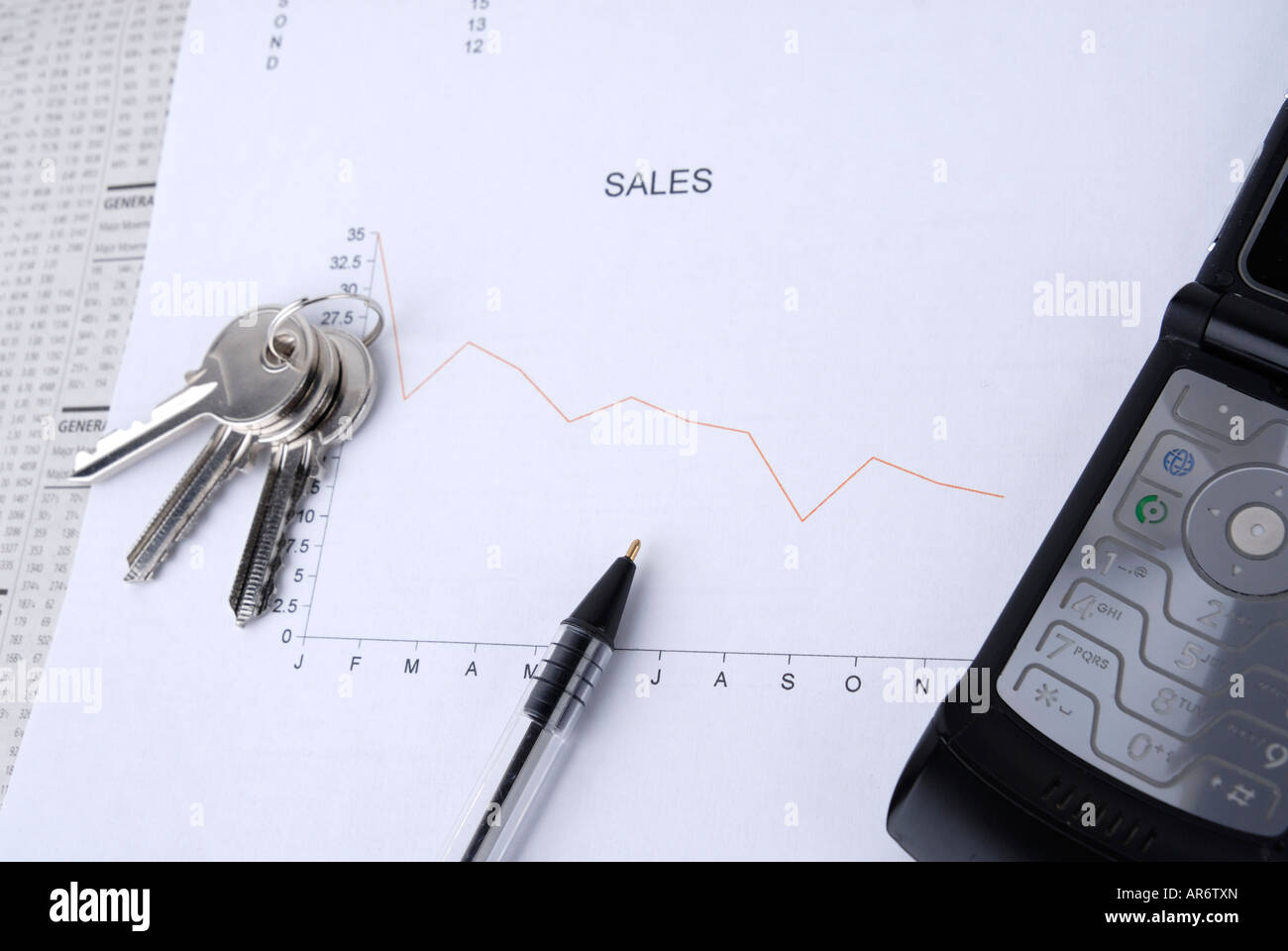 Office items on a graph Stock Photo - Alamy