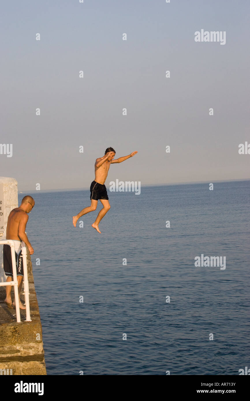 Child jumping off wall hi-res stock photography and images - Alamy