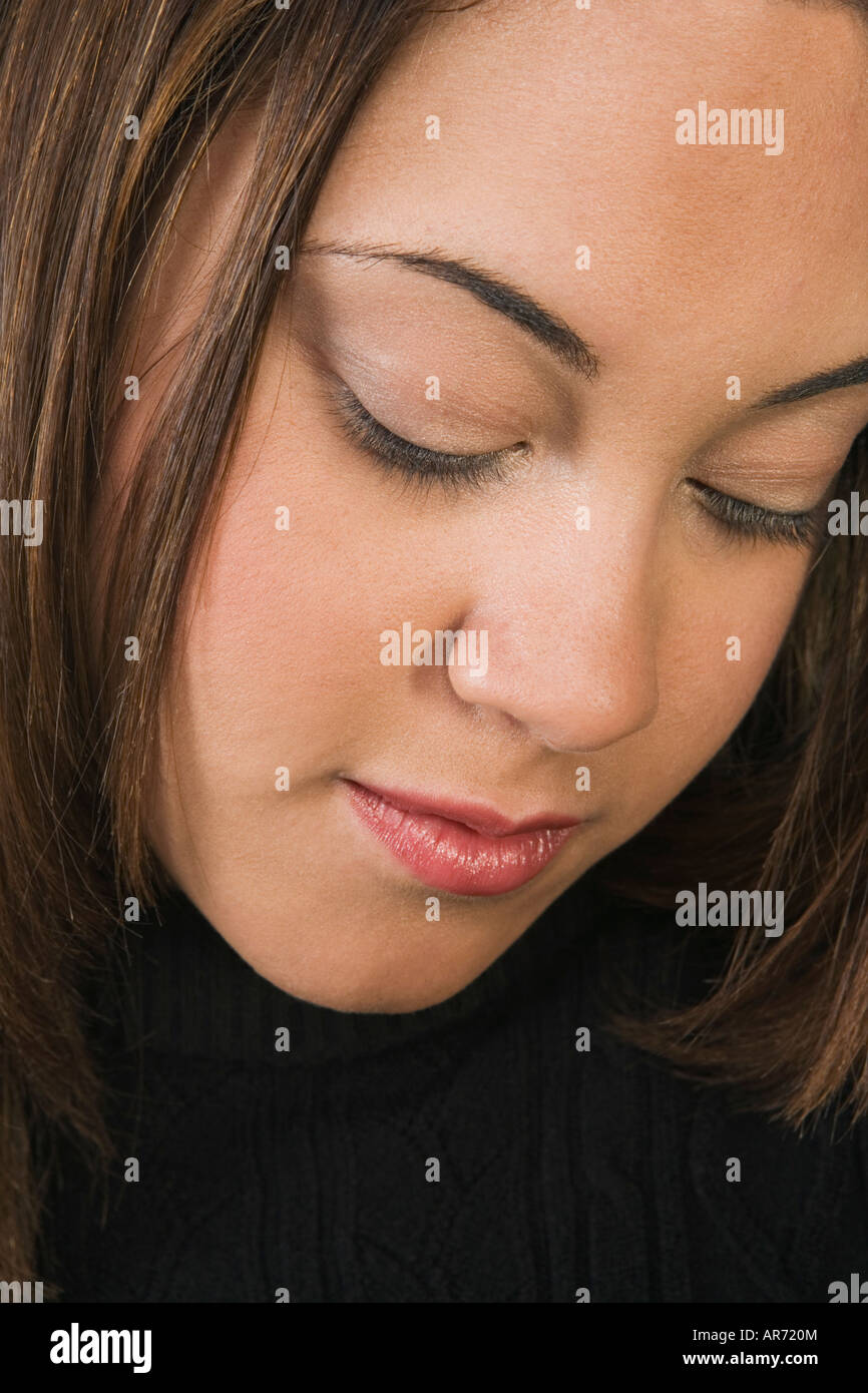 Woman looking downward hi-res stock photography and images - Alamy