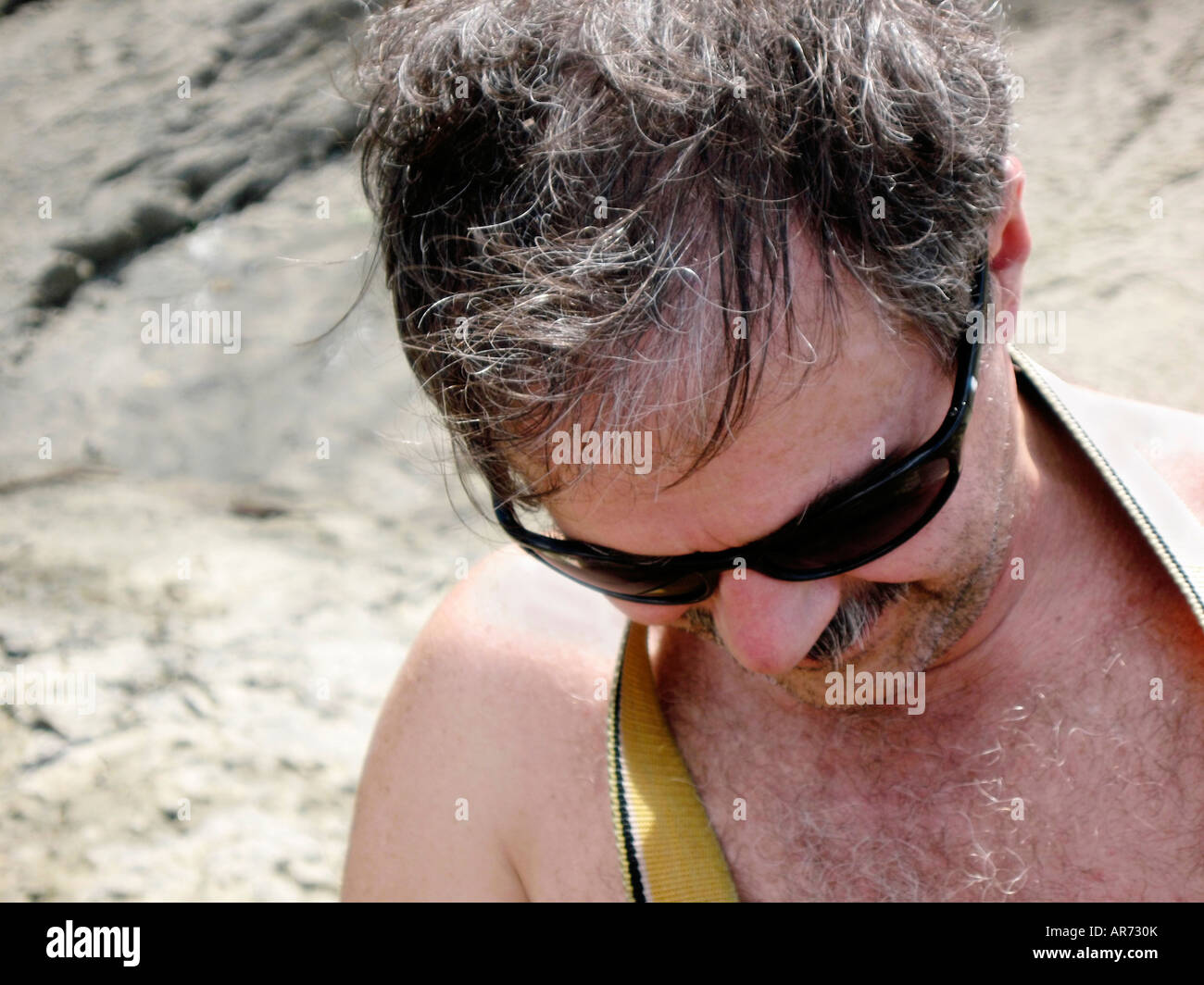 Man looking downward Stock Photo - Alamy