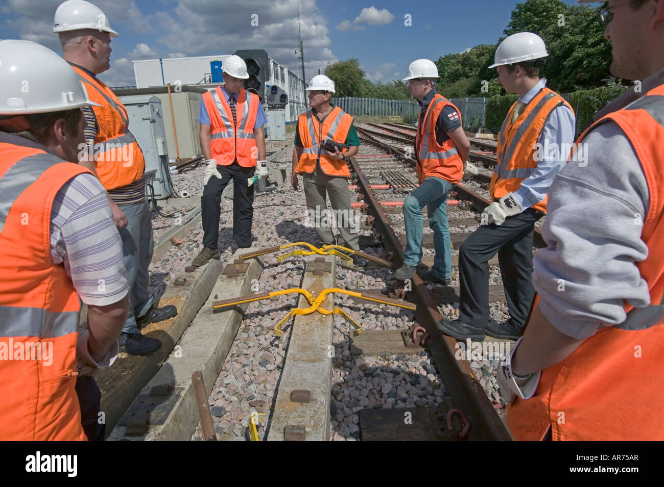 Instructor discusses correct heavy lifting techniques with railway ...