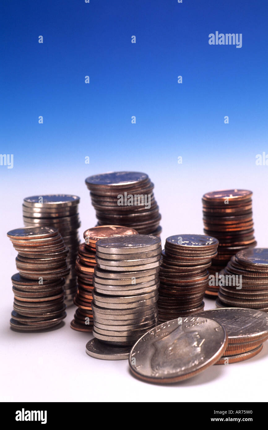 Stack on US coins in pile money Stock Photo - Alamy