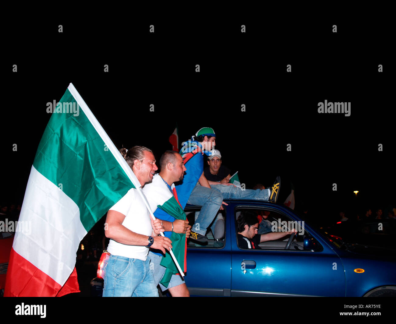 Italian football fans marching with Italian tricolor flag night Italy ...