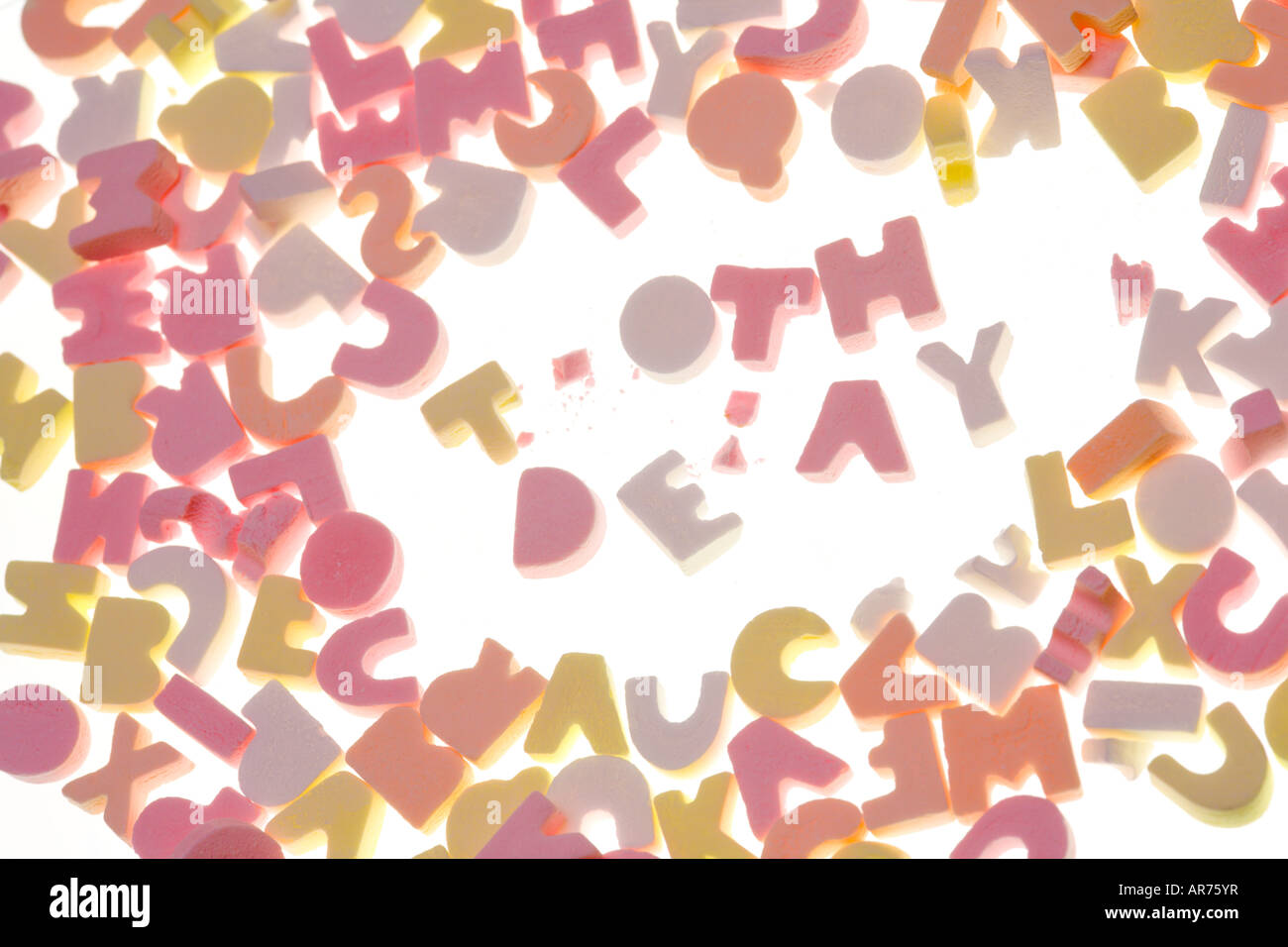 Tooth decay spelt out using ABC sweets Stock Photo - Alamy