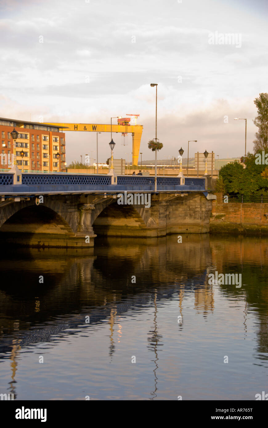 Bridge over Lagan River, famous yellow cranes Samson and Goliath behind ...