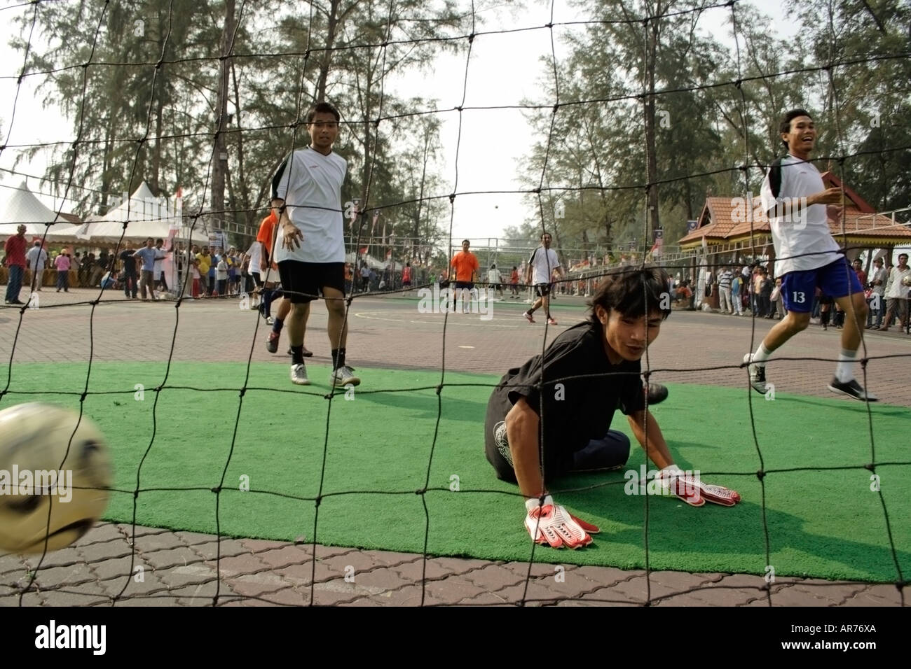 Gooaal! A player jumps in joy after scoring a goal in Futsal ...