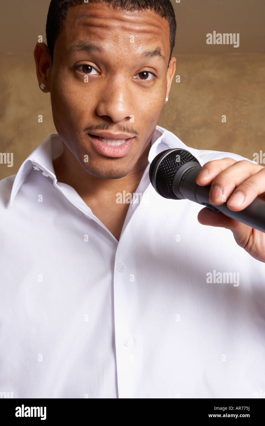 African man singing into microphone Stock Photo - Alamy
