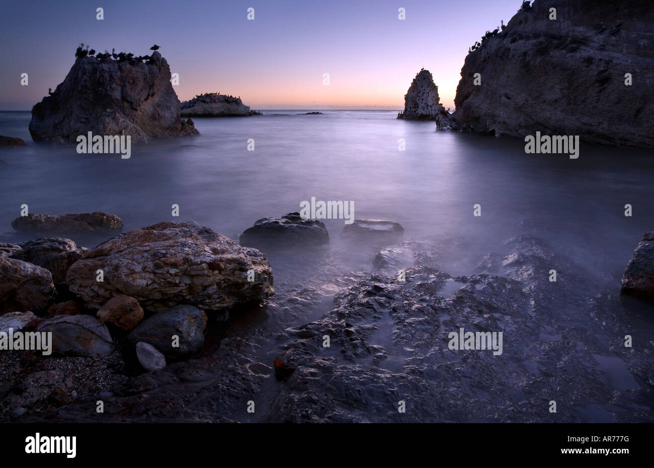 Shell beach sunset Stock Photo - Alamy